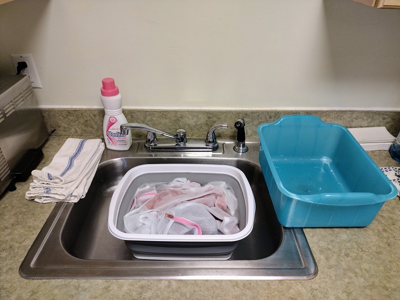 Hand washing vintage clothing and lingerie, modern lingerie, and ...